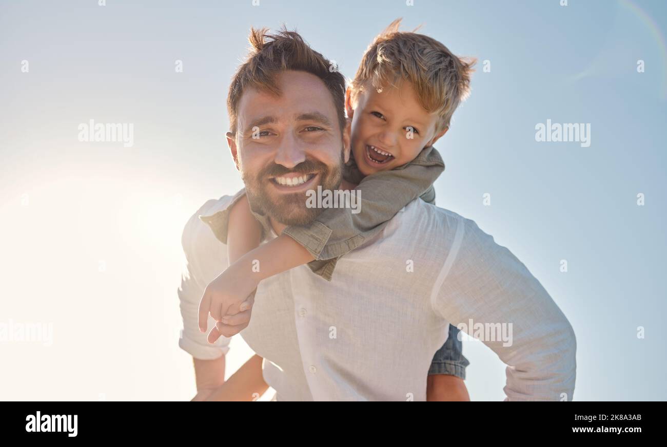 Family, portrait and father and son relax against a blue sky background ...