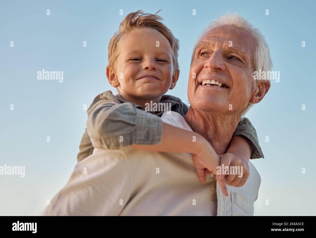 Piggyback, child and grandfather with smile in nature for freedom, love ...