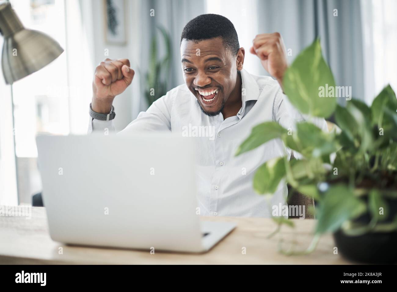 Yes I finished the project. a handsome young businessman sitting alone ...