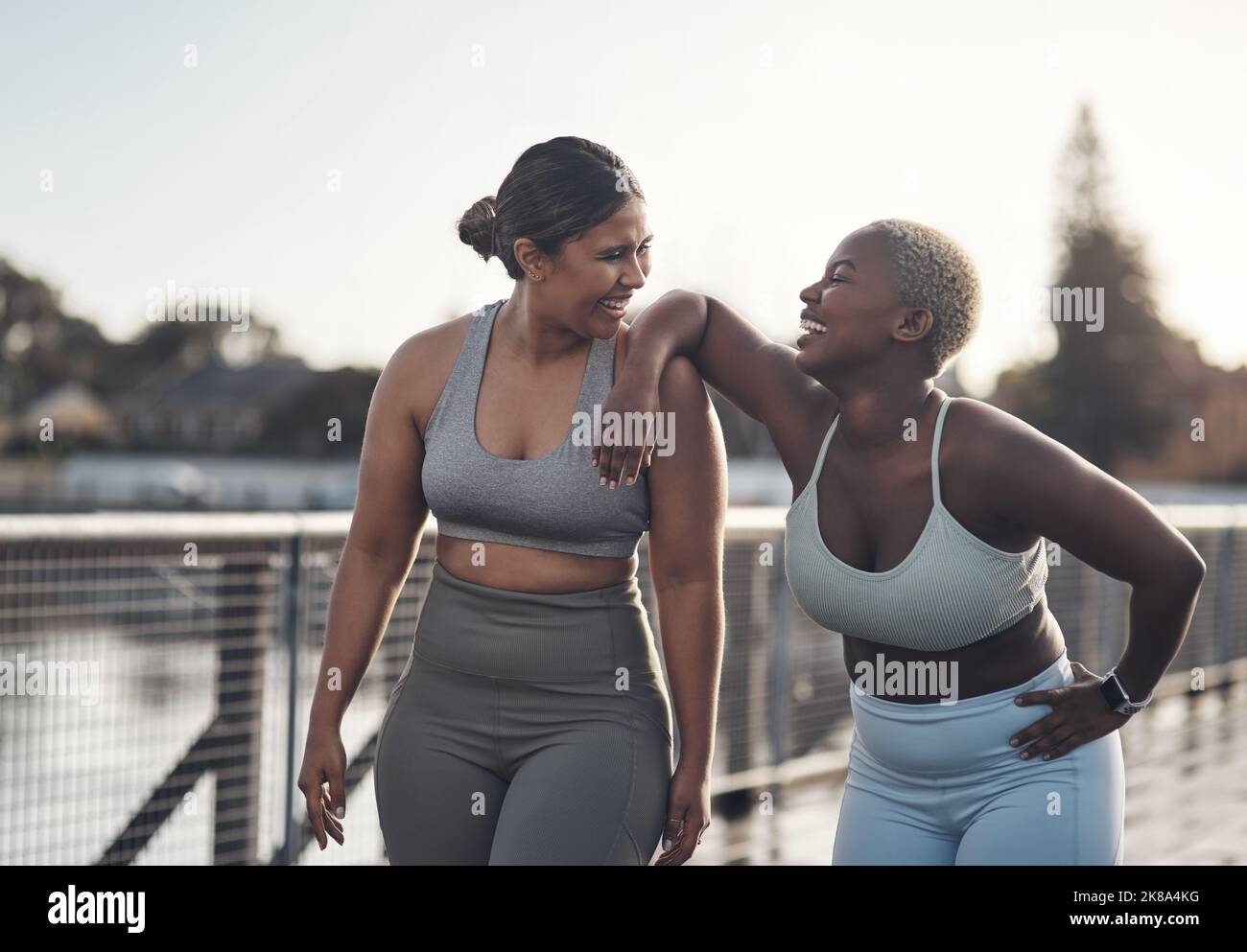 Exercising together really brought us closer together. two friends out ...