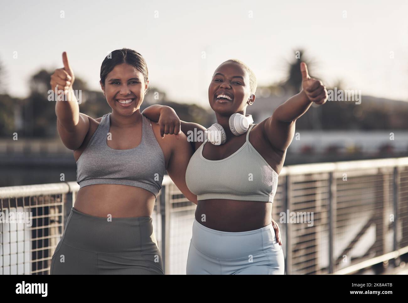 We agree that working out with a friend is more fun. two young women ...
