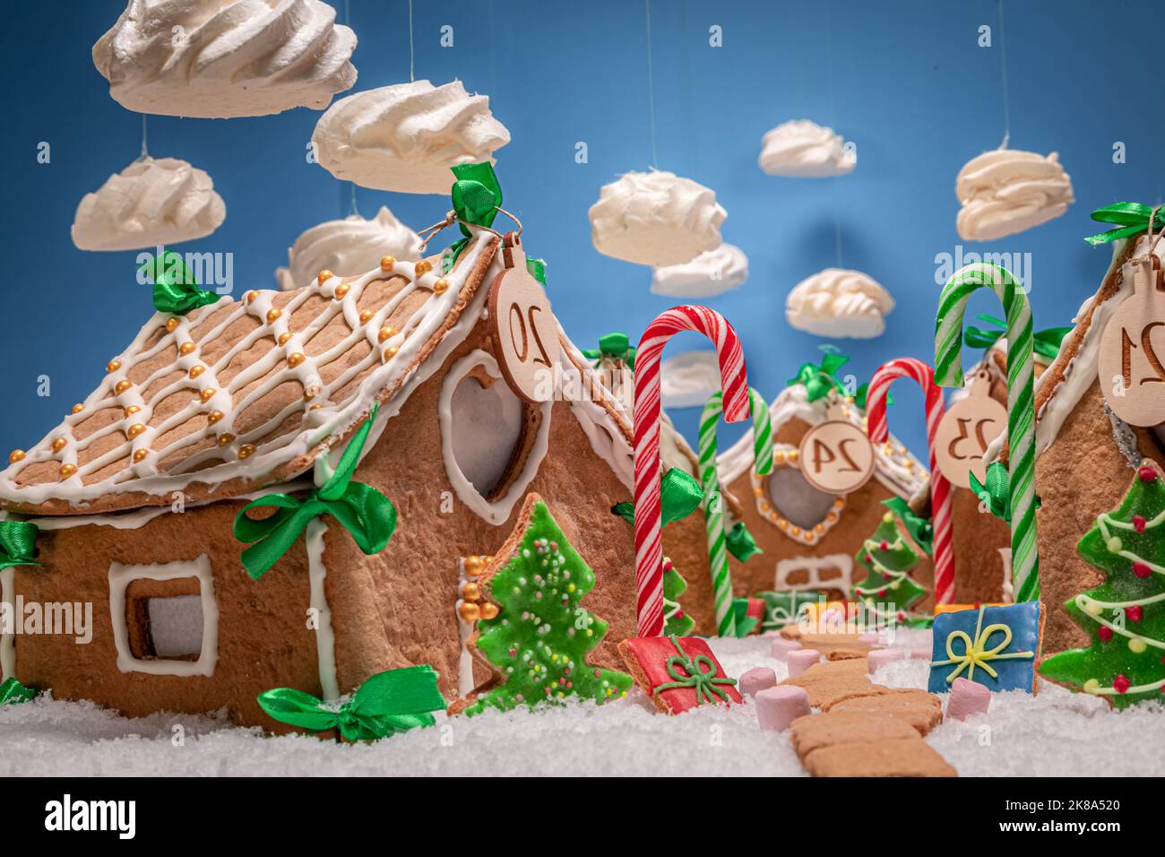 Beautiful and lovely Christmas gingerbread village with meringue clouds ...