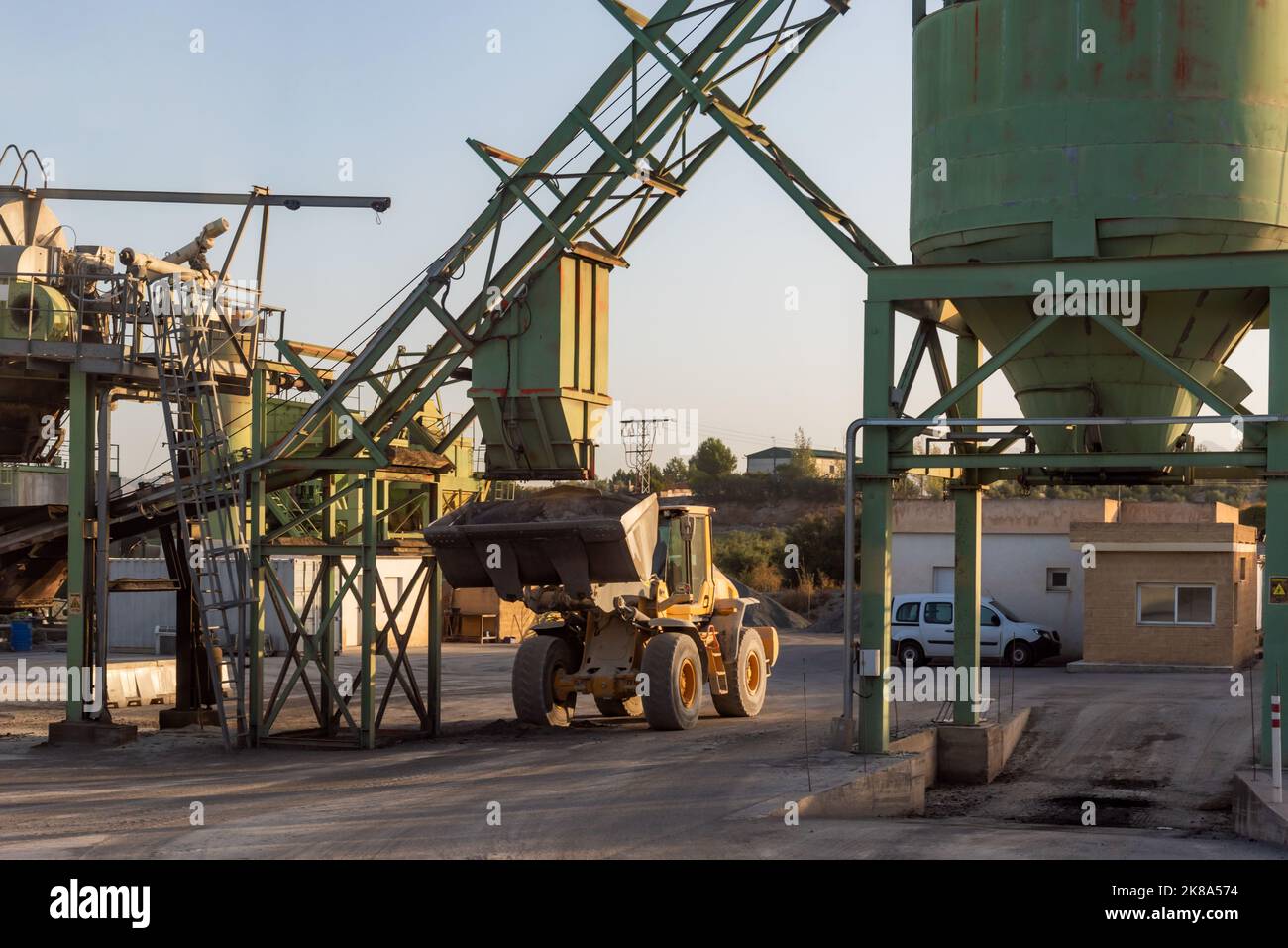 Asphalt bitumen manufacturing plant with an excavator in the process of ...
