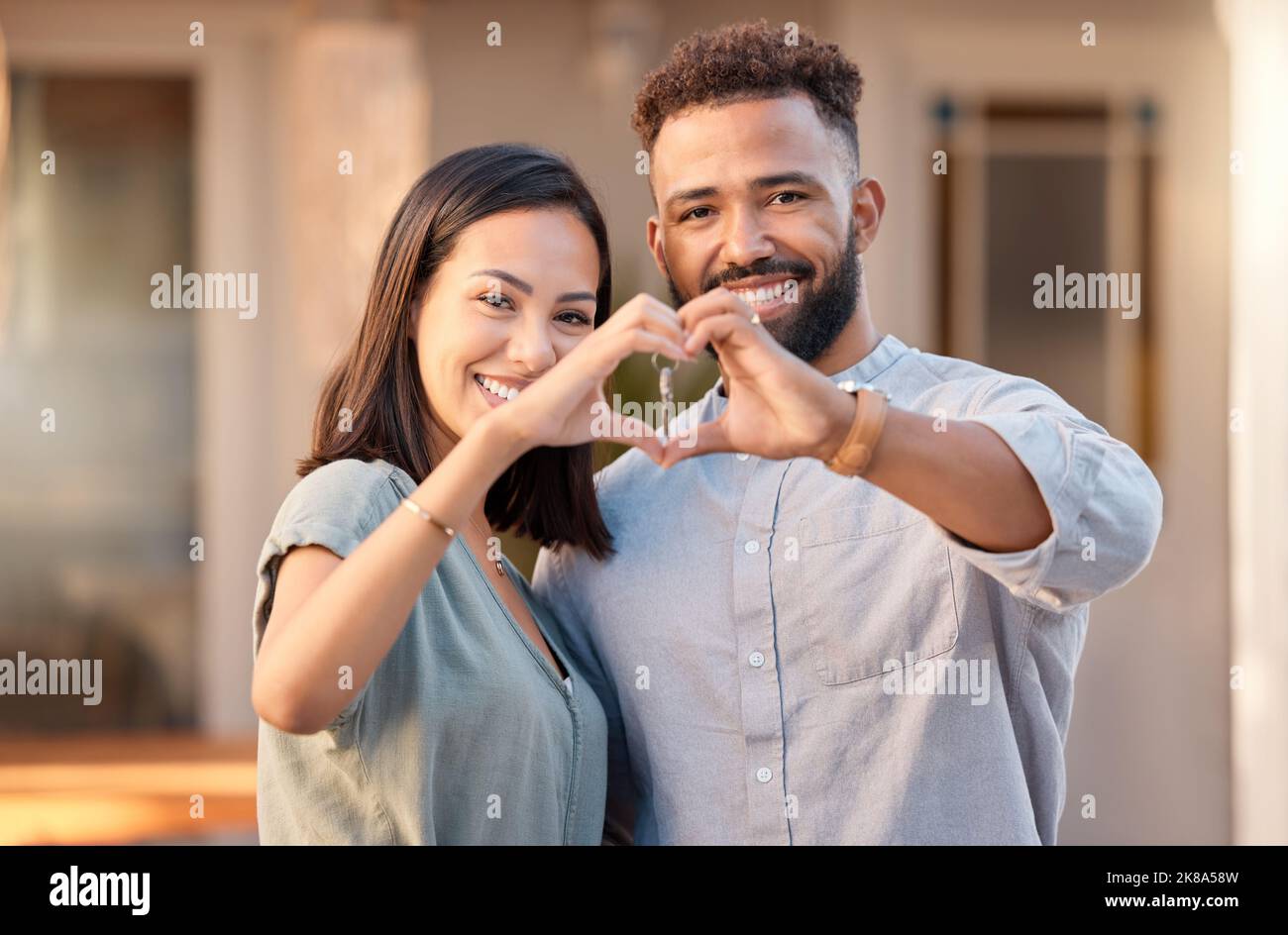 Love, hand and heart with couple in front of house, family and real ...