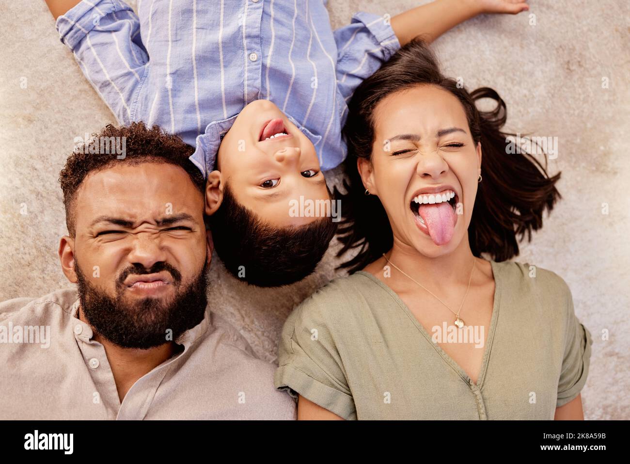 Floor, family and fun on a carpet in living room with cheerful, silly ...