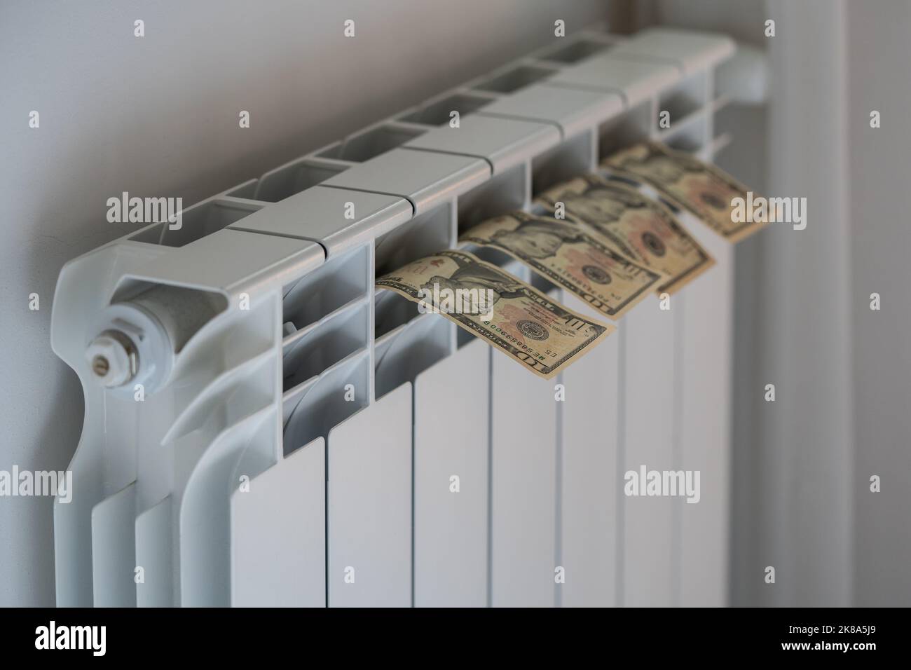 Dollar banknotes put on warm room heating battery to dry from ...