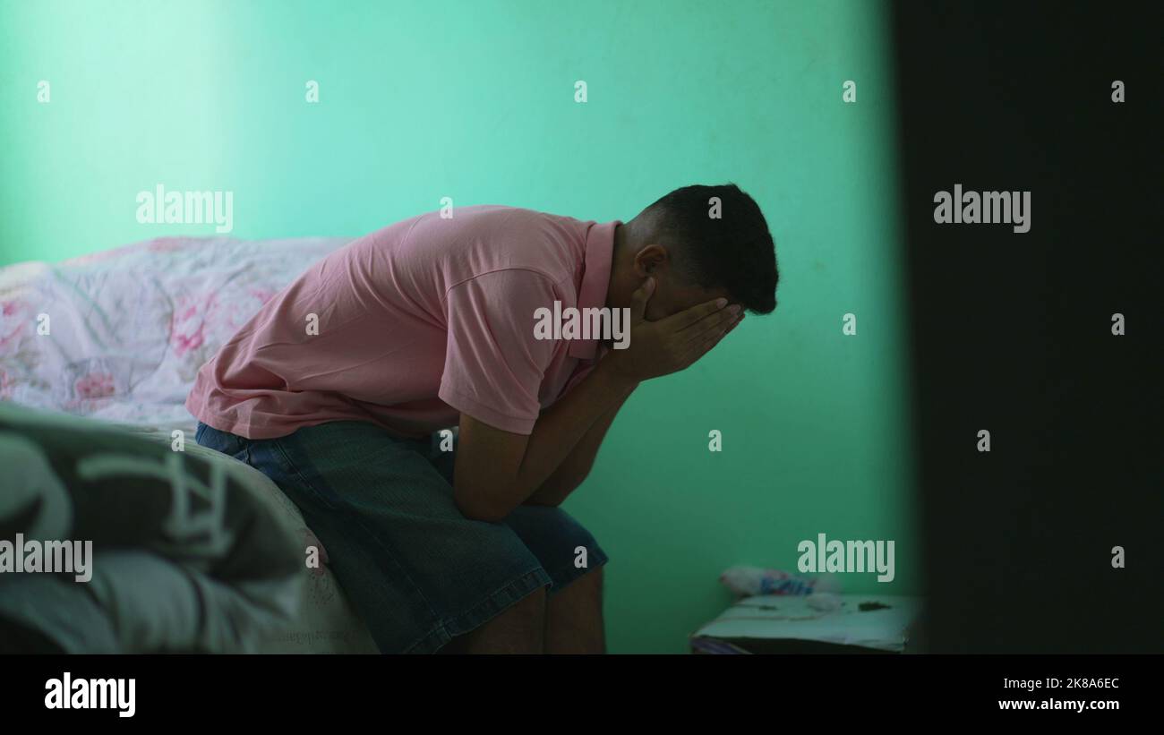 Frustrated person covering face feeling anxiety. Man suffering from ...