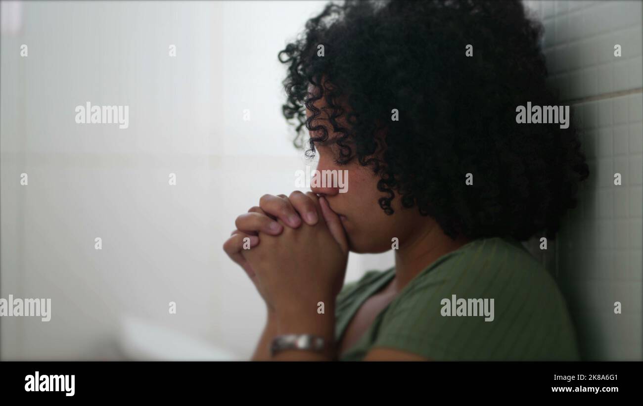 One Brazilian young woman in prayer during difficult times. A South ...
