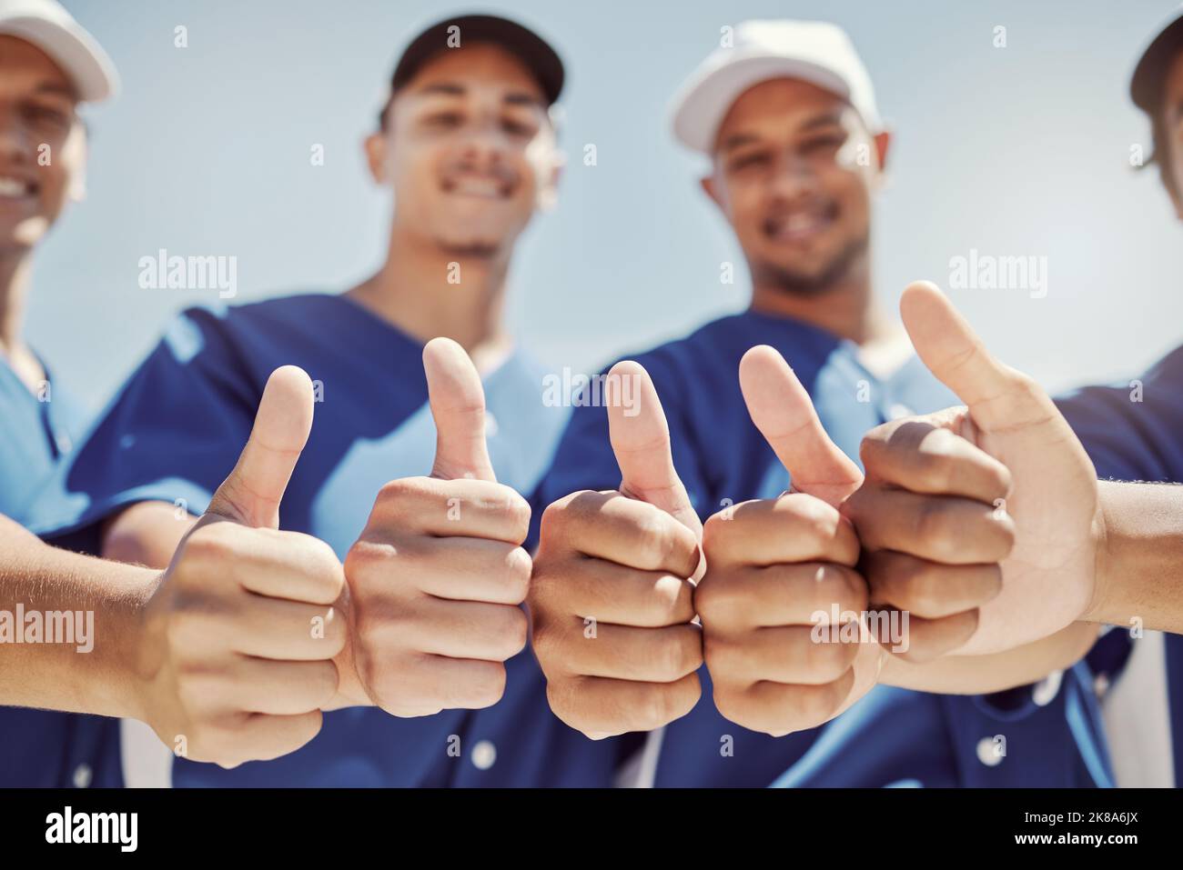 Baseball player, thumbs up and sports teamwork support, winner success ...