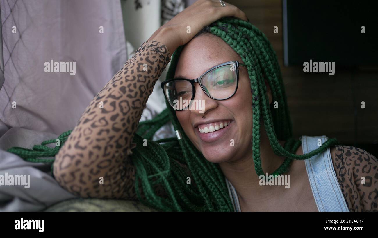 Millennial girl with box braids hairstyle smiling at camera. One young ...