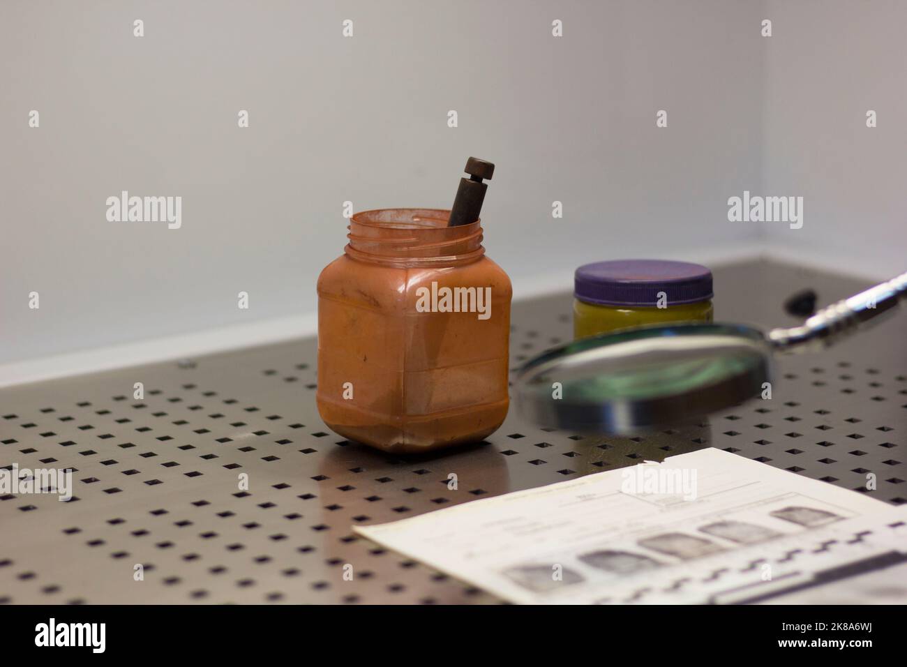 Magnifying glass, fingerprint card, on the background with magnetic ...