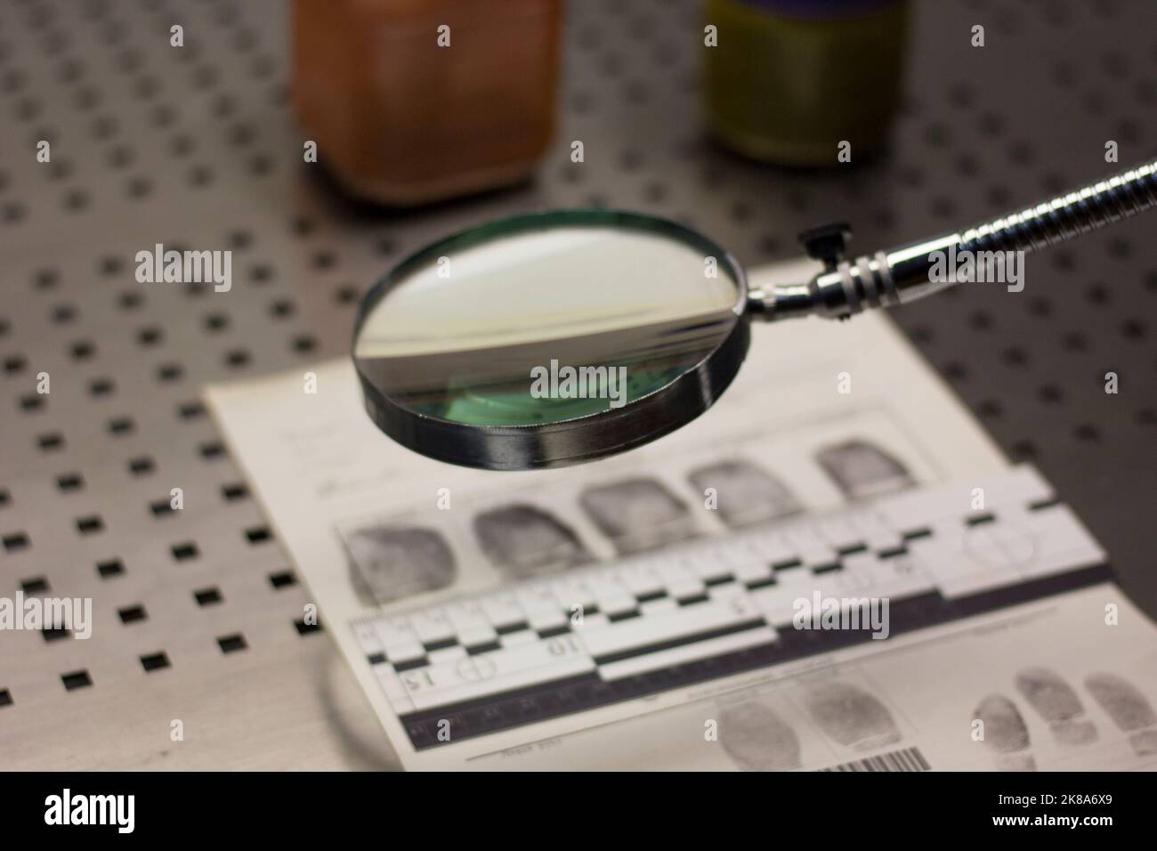 Magnifier with fingerprints and fingerprint Stock Photo - Alamy