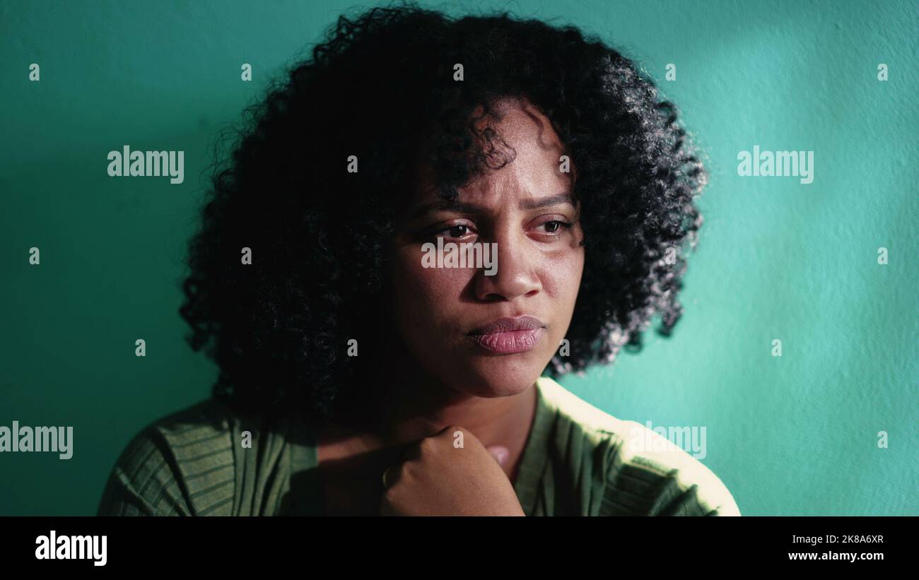 Worried woman with negative emotion. Preoccupied African American ...
