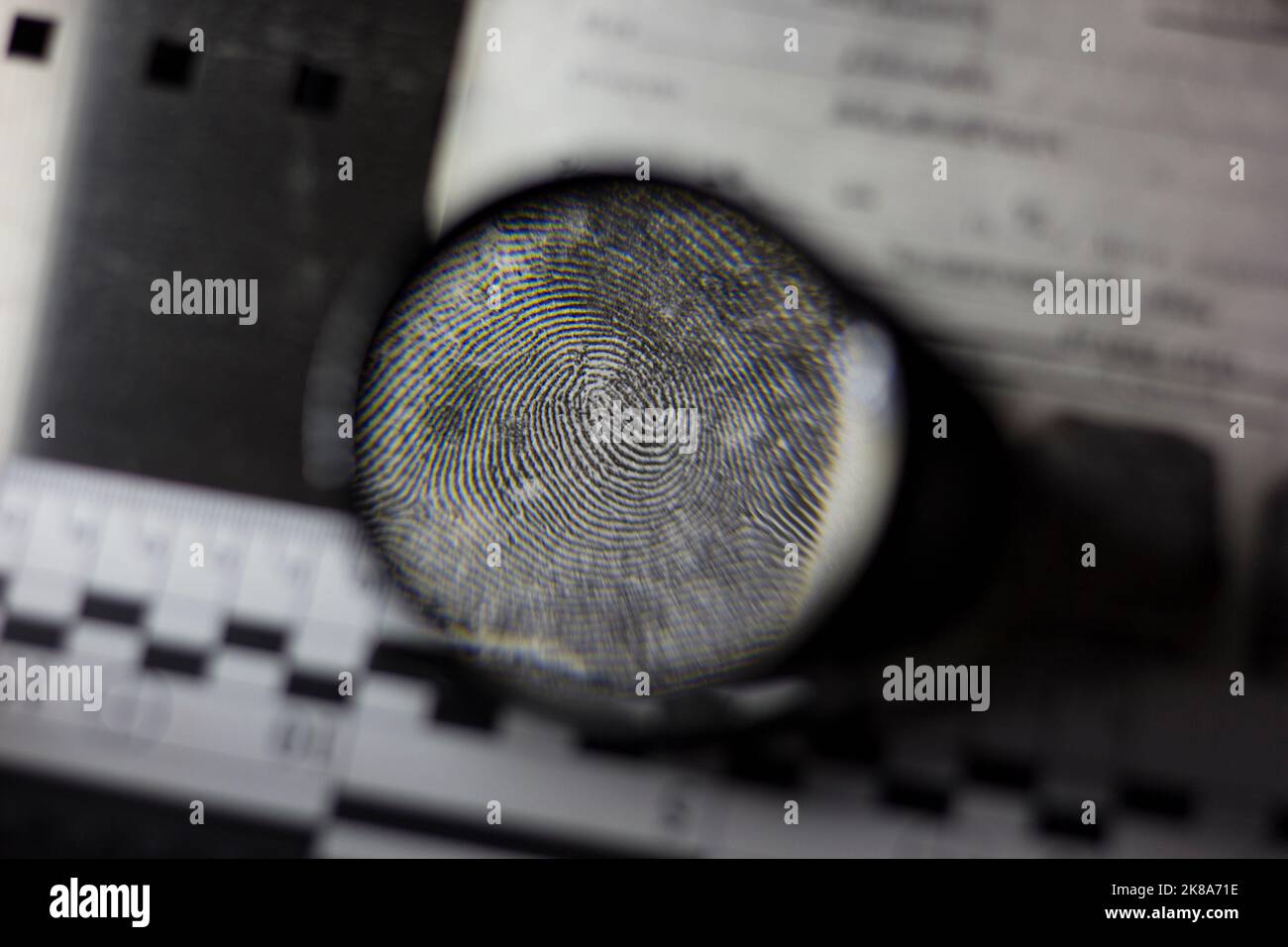 Forensic ruler, magnifying glass, fingerprint card and a jar of ...