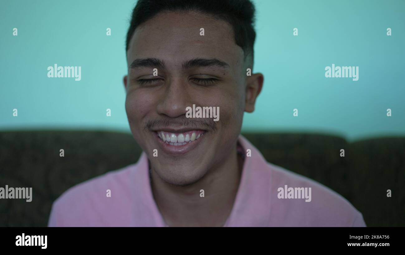 One hispanic man laughing and smiling. A casual latin south american ...