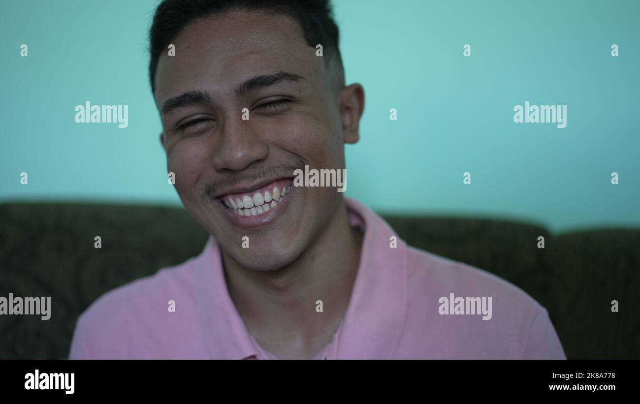 One hispanic man laughing and smiling. A casual latin south american ...