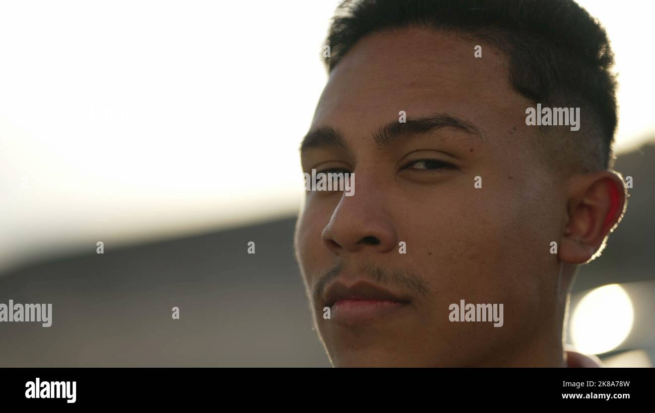 Closeup South American hispanic Brazilian young man face with serious ...