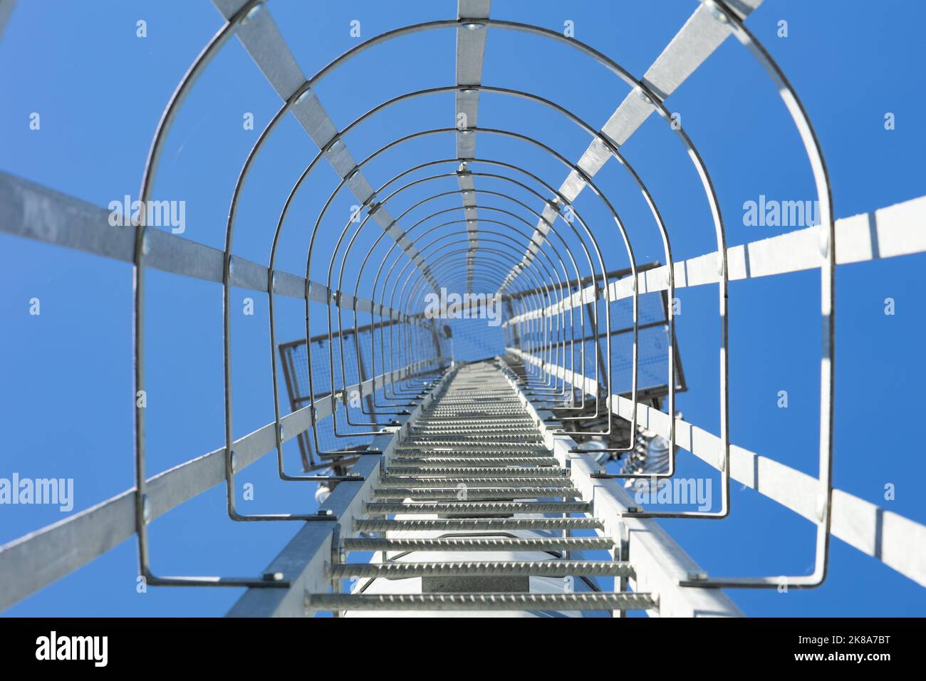 Fixed ladder for climbing on telecommunication tower Stock Photo - Alamy