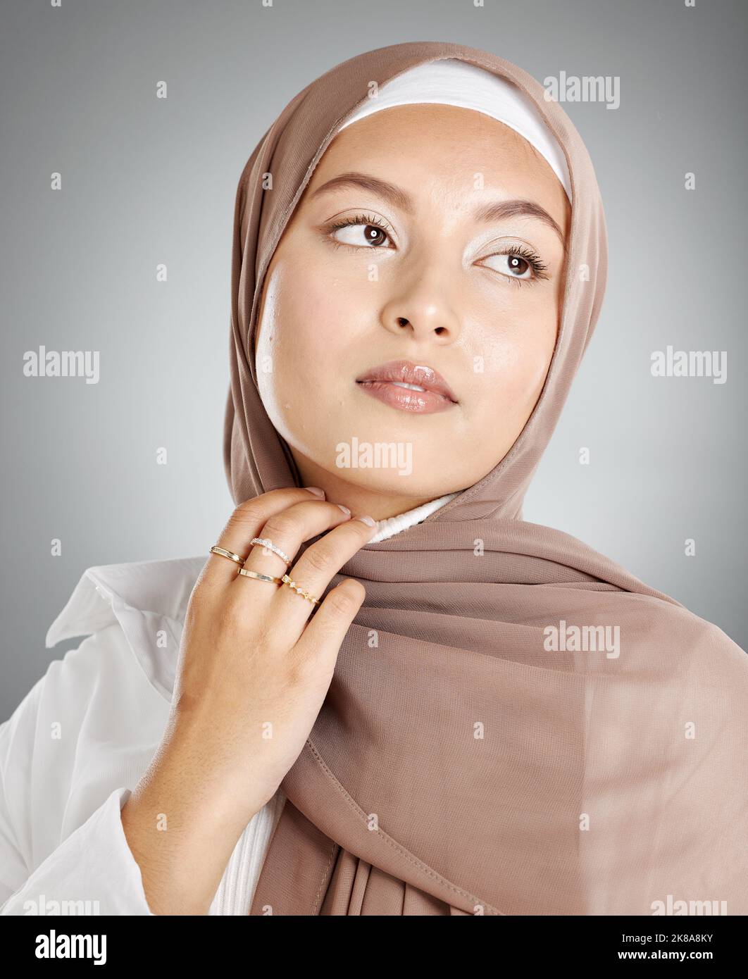 Skincare, makeup and Islamic woman with an hijab against a grey mockup ...