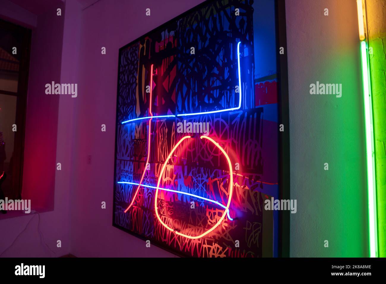 Neon light installation iside building in Prague Stock Photo - Alamy