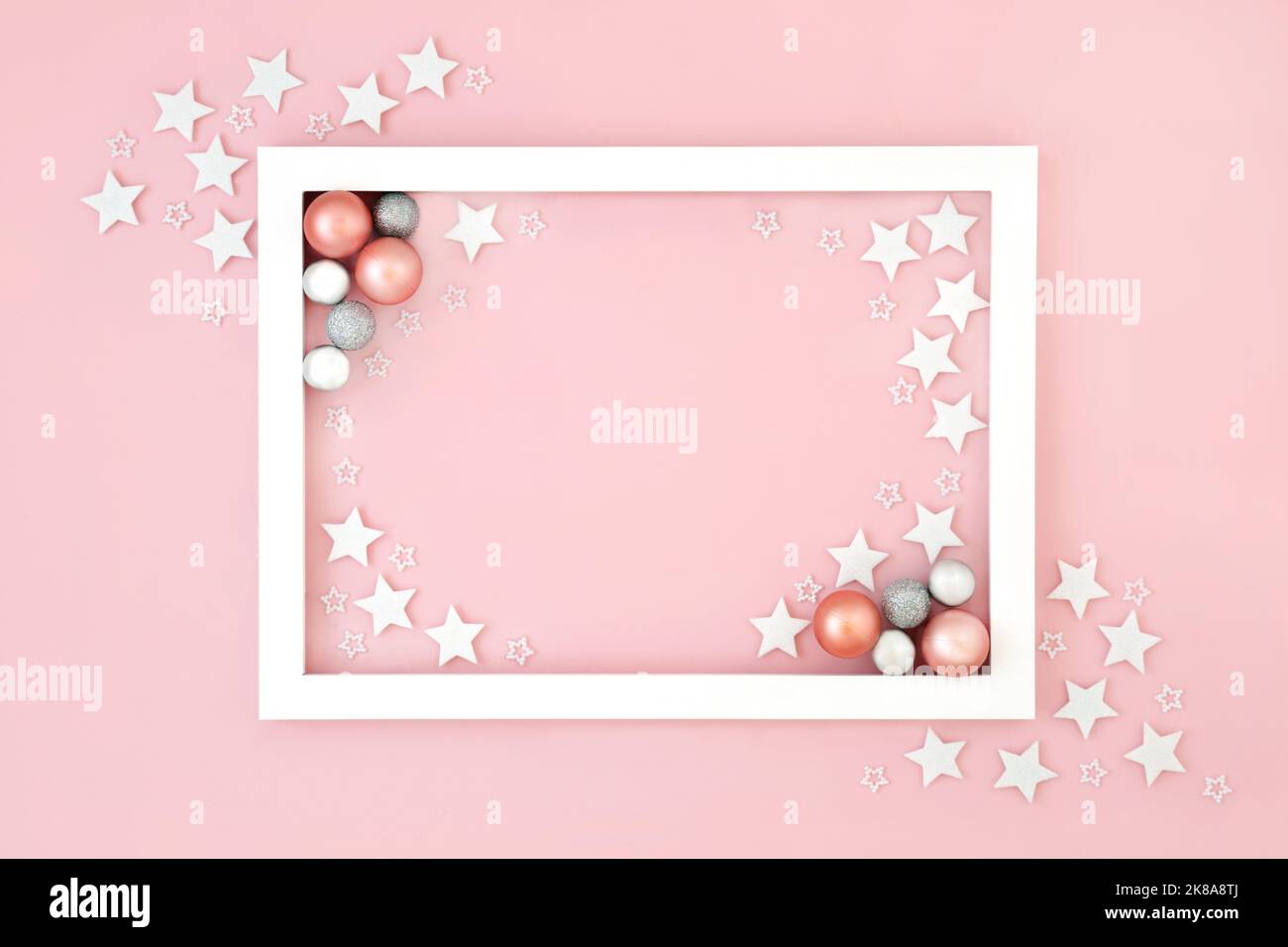 Christmas pink background border with white stars and tree decorations ...