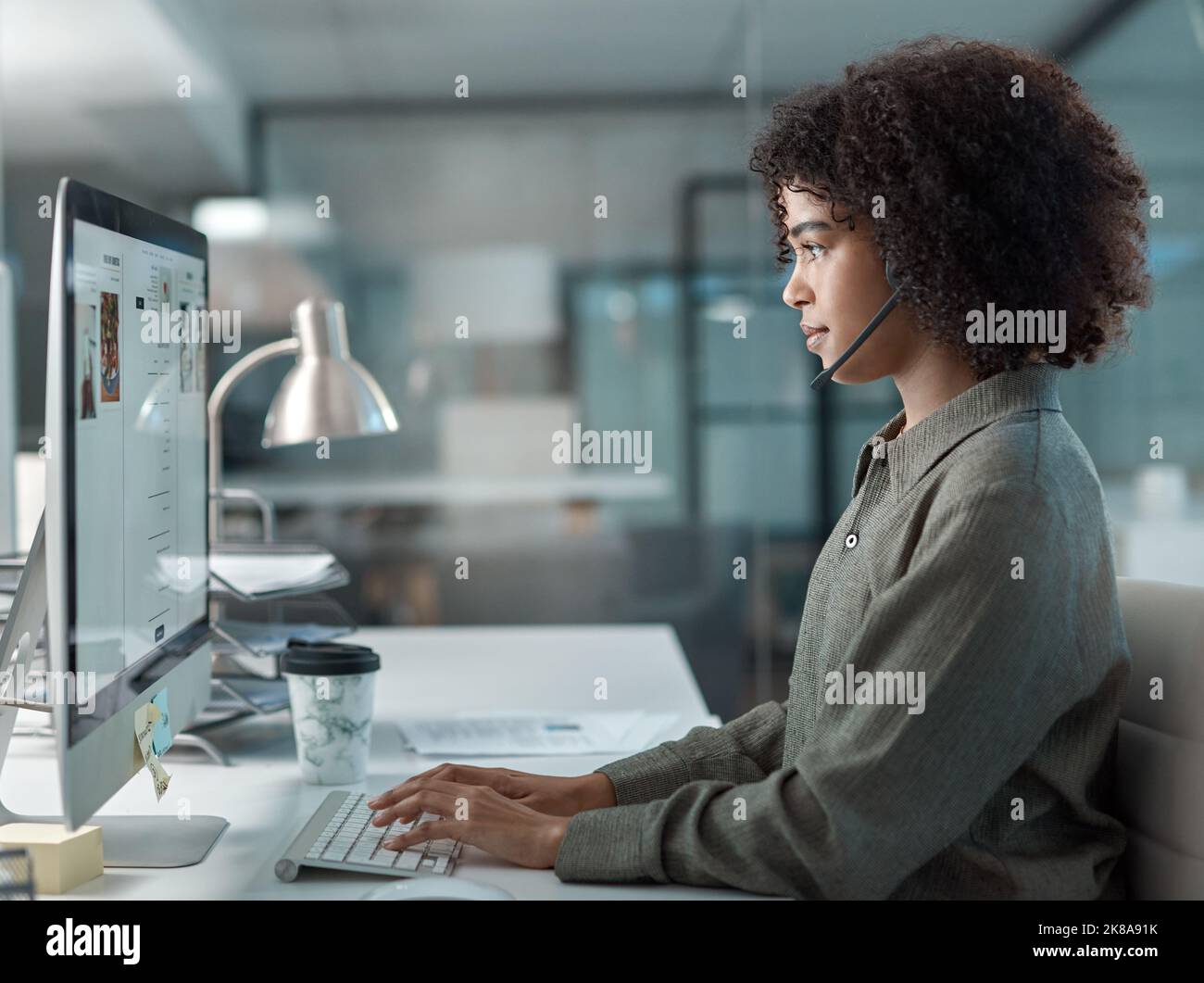 Women headset typing hi-res stock photography and images - Alamy