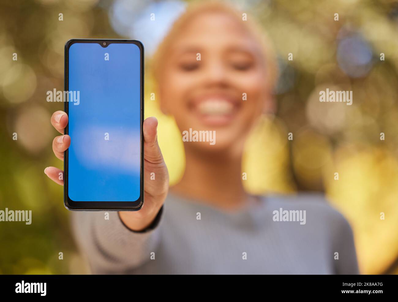 Green screen phone, mockup and woman blue mobile app for advertising, brand and digital ...