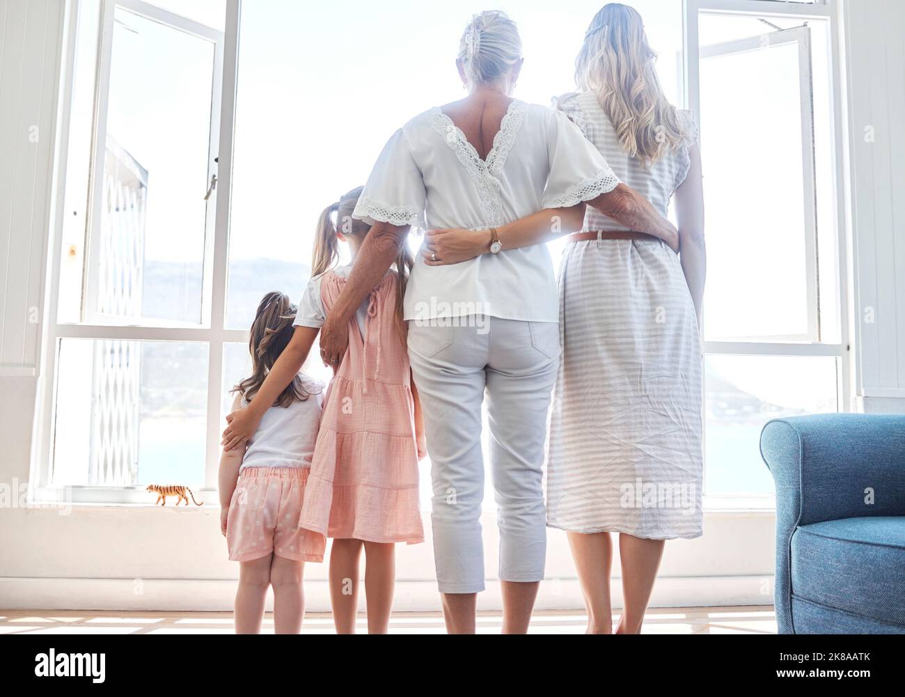 Women, girl and family with back at window together for solidarity ...