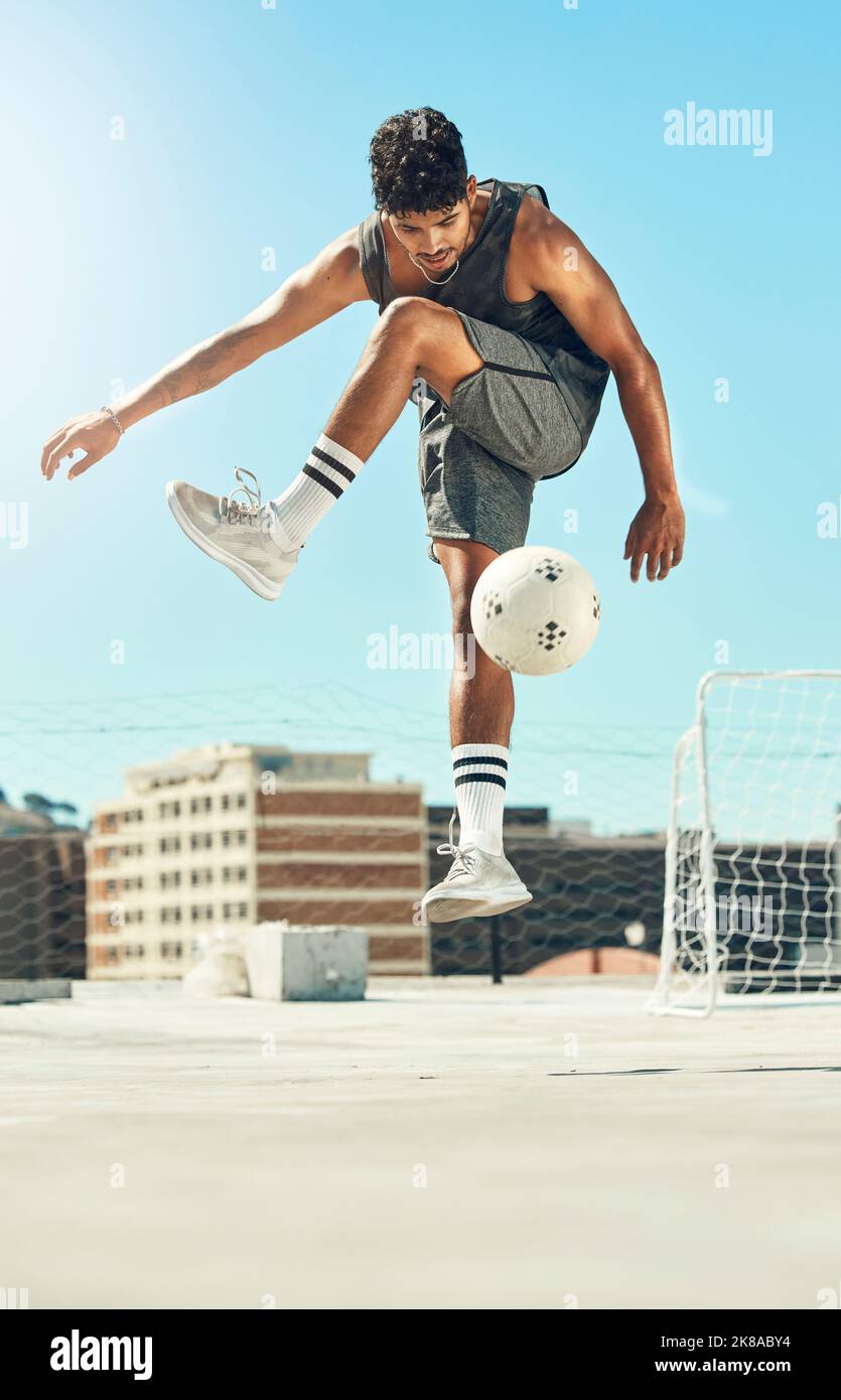 Soccer, skill and man athlete training with a ball for a game or ...