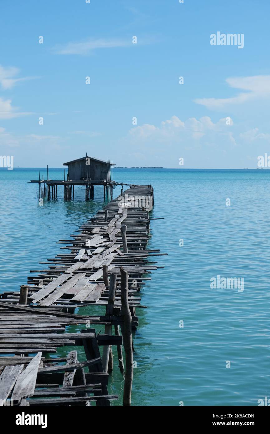 A rustic bridge connecting the jetty at pulau bum bum Stock Photo - Alamy
