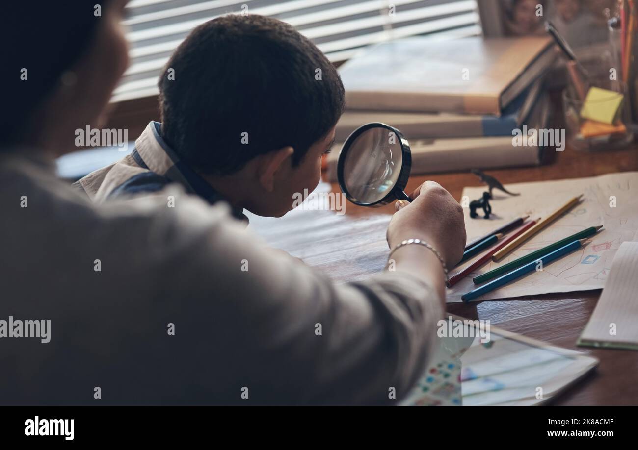 Life is full of little surprises. an adorable little boy using a ...