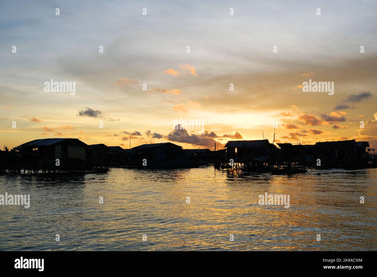 Beautiful sunset time at a bajau village, Pulau Omadal Stock Photo - Alamy