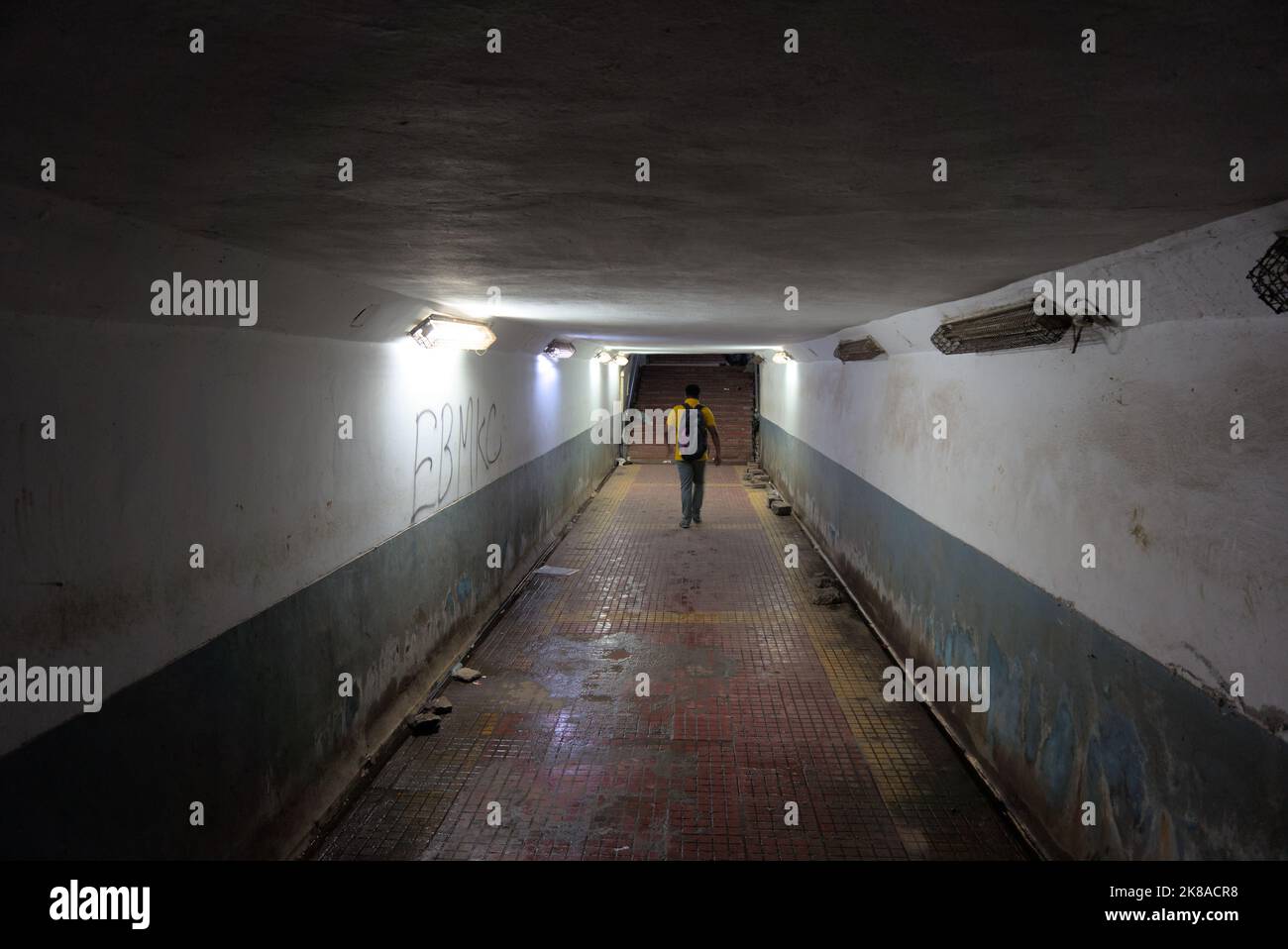 Urban underground pedestrian crossing passage at night. Old, grunge ...
