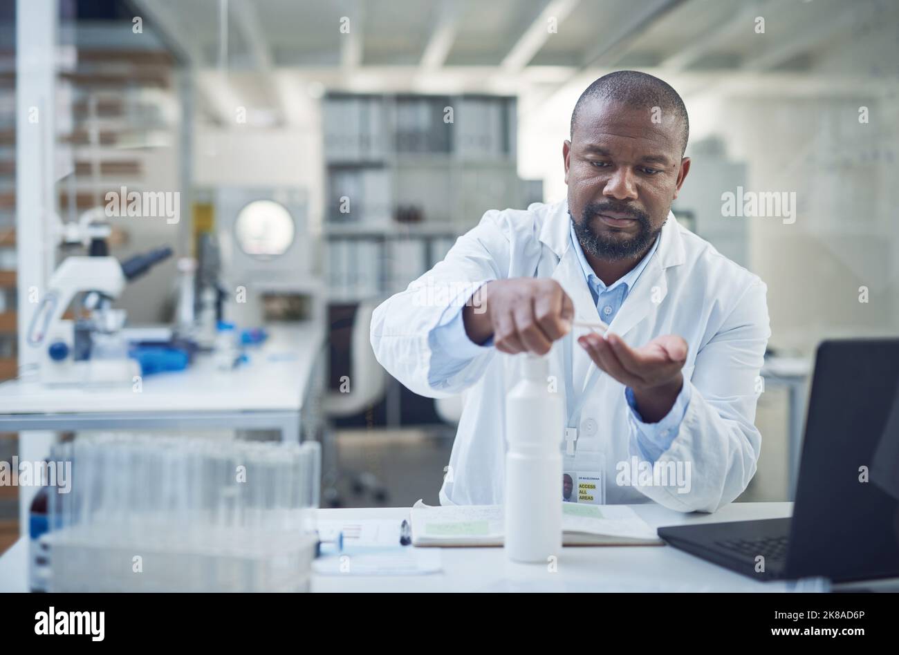 We cure disease, we dont spread them. a scientist disinfecting his ...