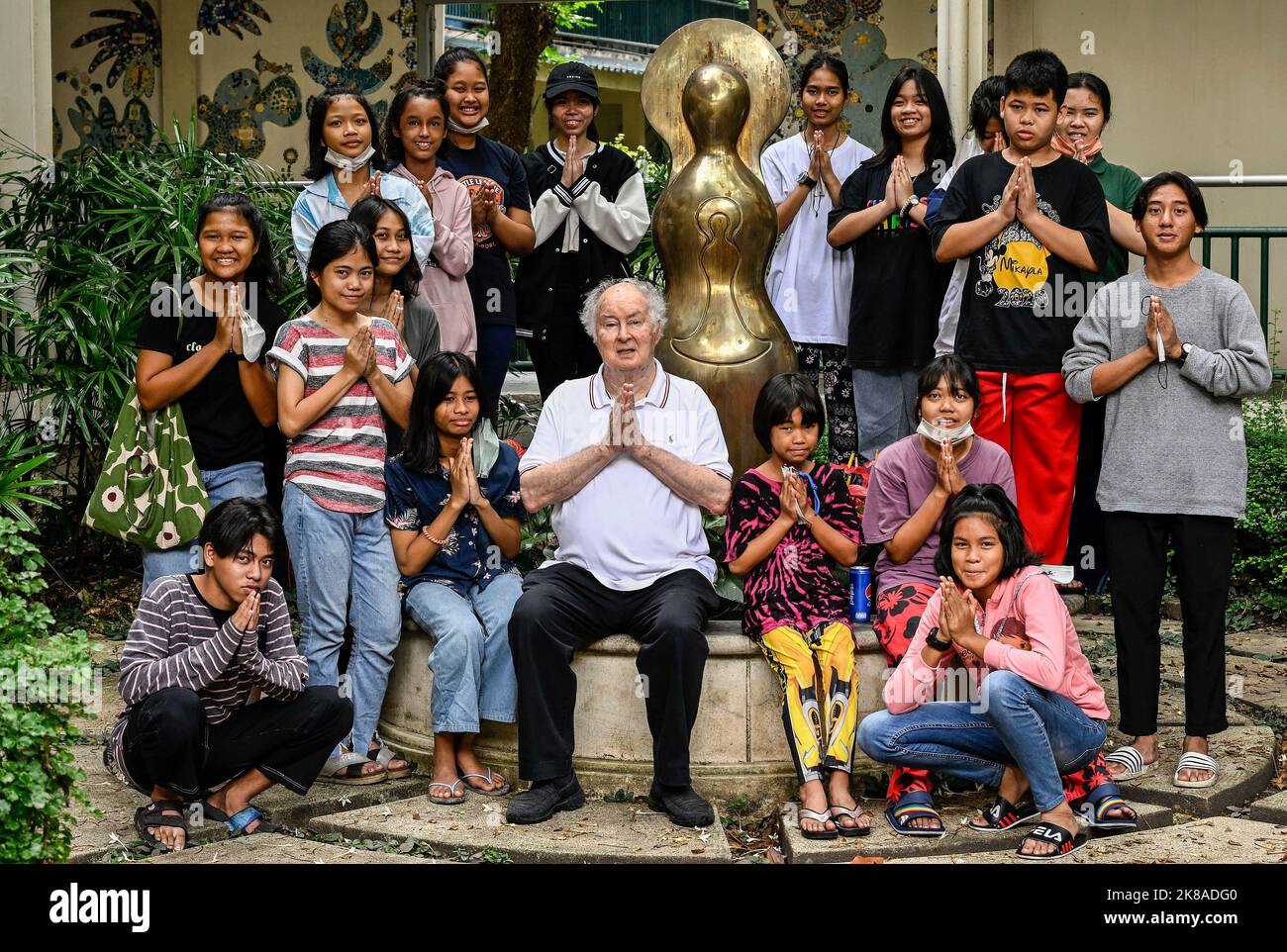 Father Joseph H. Maier, 82, of the USA poses for a group picture with ...