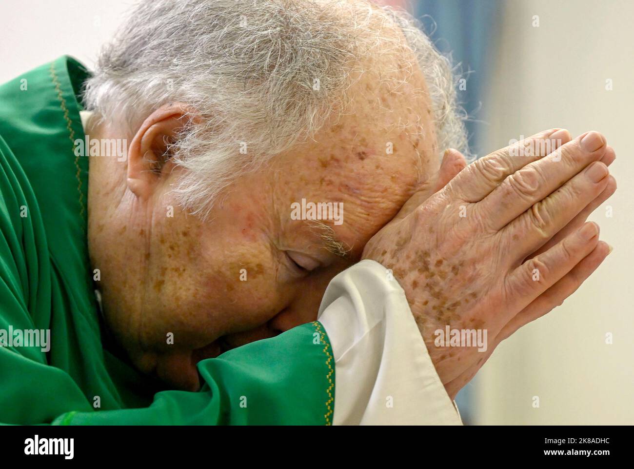 Father Joseph H. Maier, 82, of the USA is seen praying during a ...