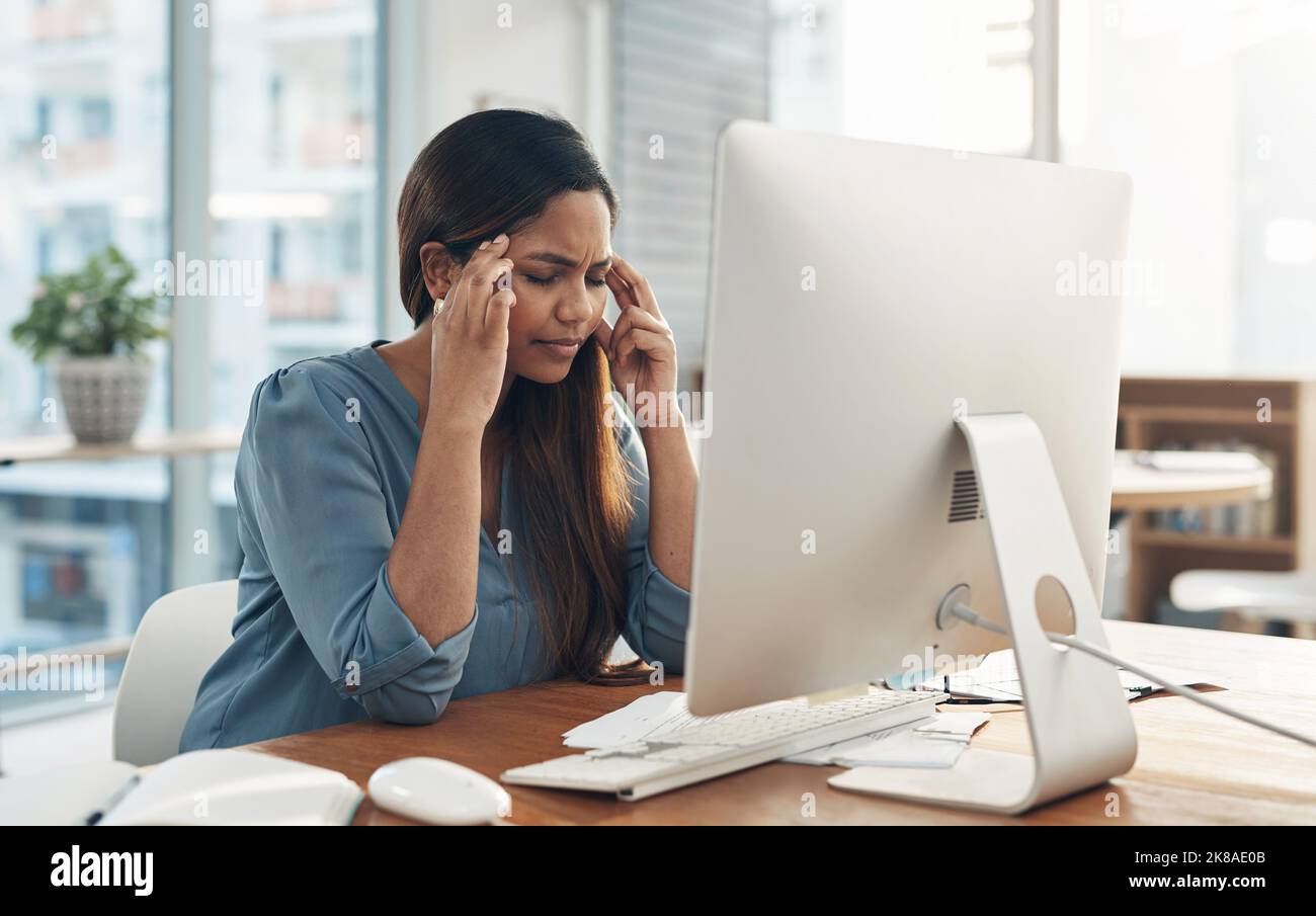 Digital eye strain can be very discomforting. a young businesswoman ...