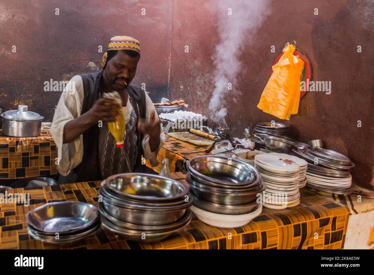 ABRI, SUDAN - FEBRUARY 26, 2019: Cook in a small restaurant in Abri ...