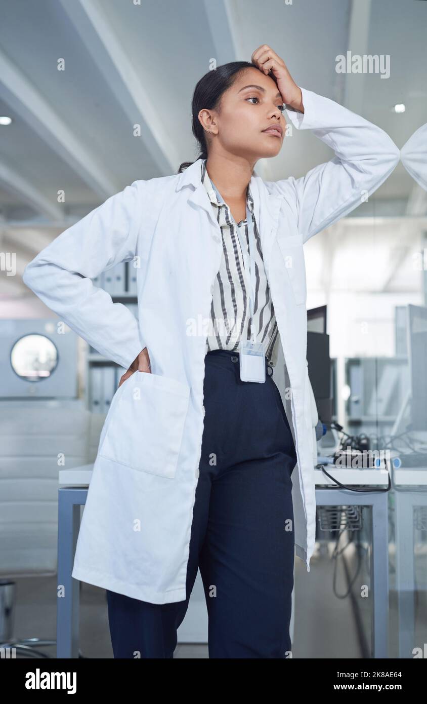 Taking on the worlds health takes its toll. a young scientist looking ...