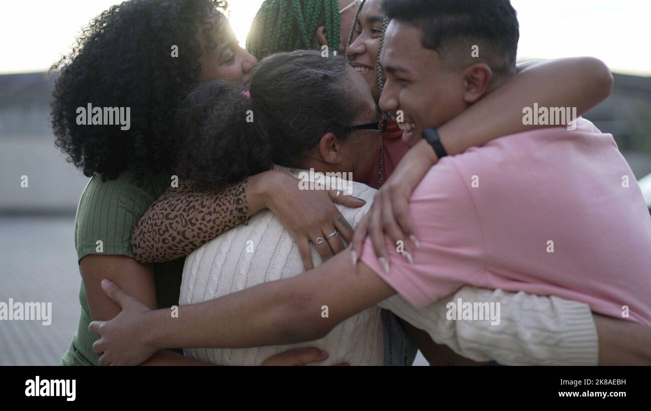 Happy Brazilian people hugging together. South American family embrace ...