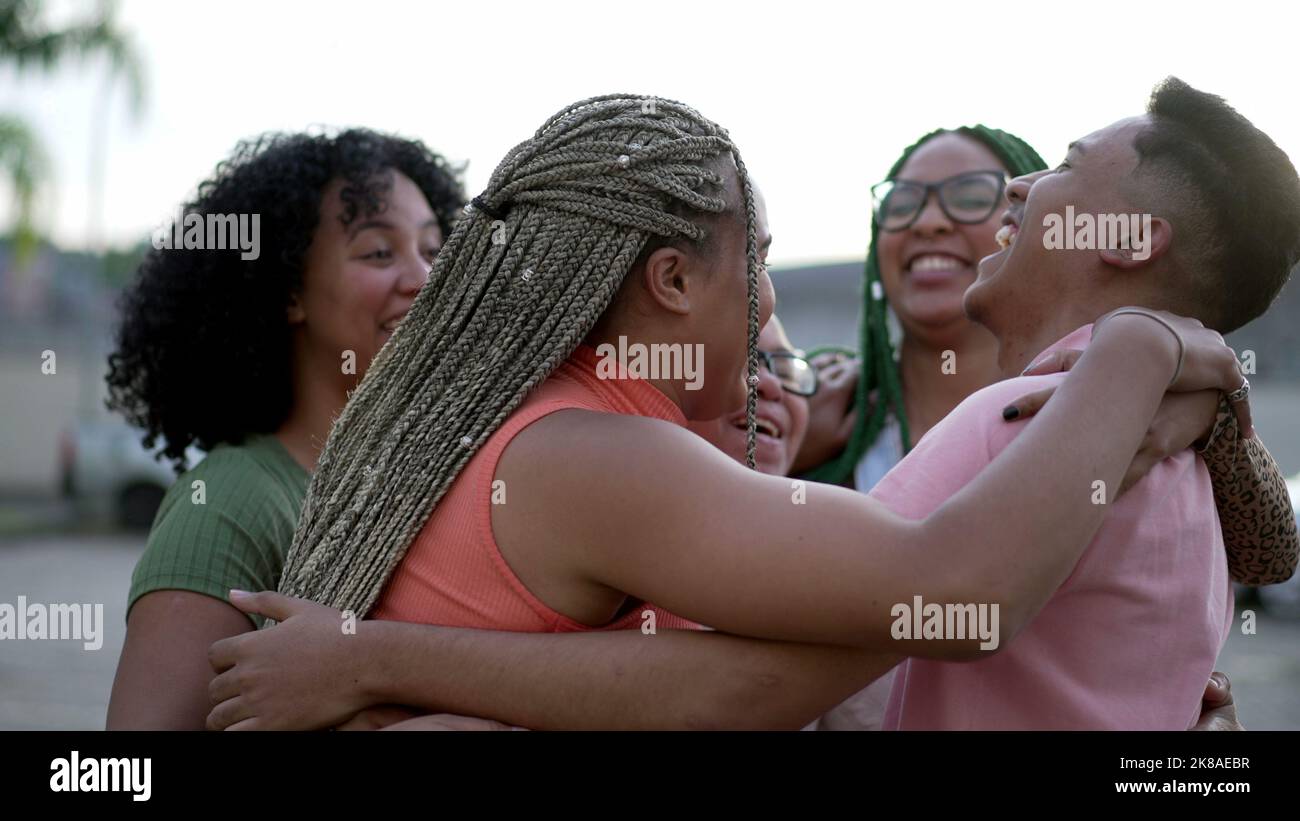Happy Brazilian people hugging together. South American family embrace ...