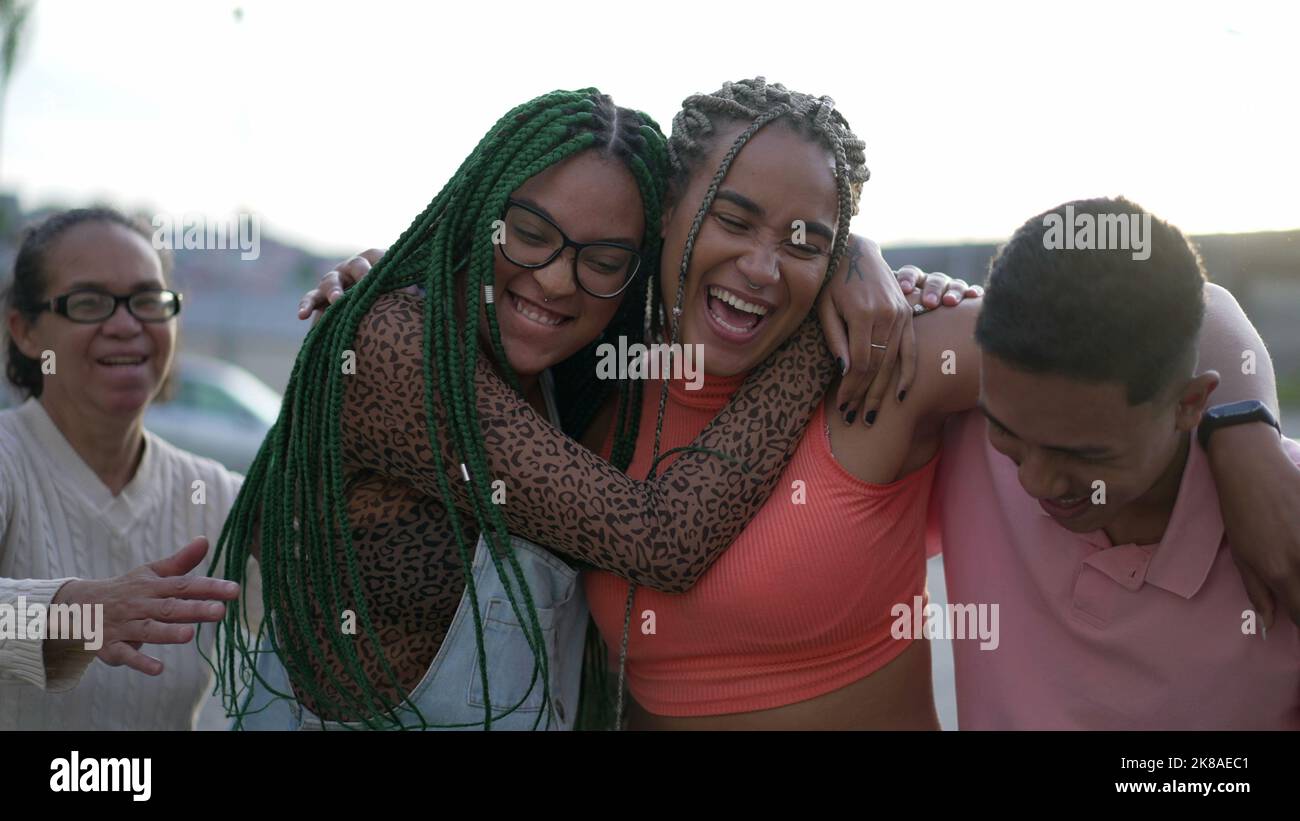 Happy Brazilian people hugging together. South American family embrace ...