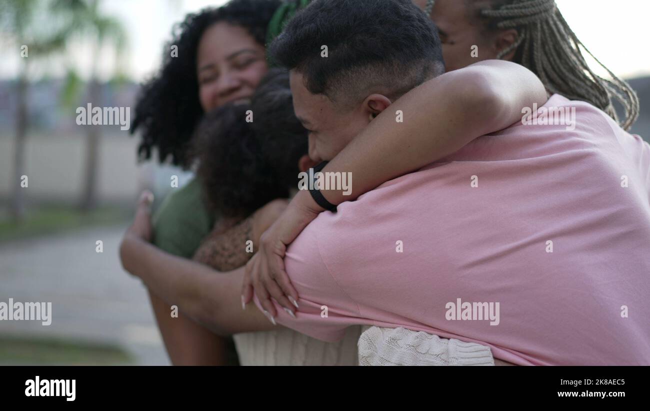 Happy Brazilian people hugging together. South American family embrace ...