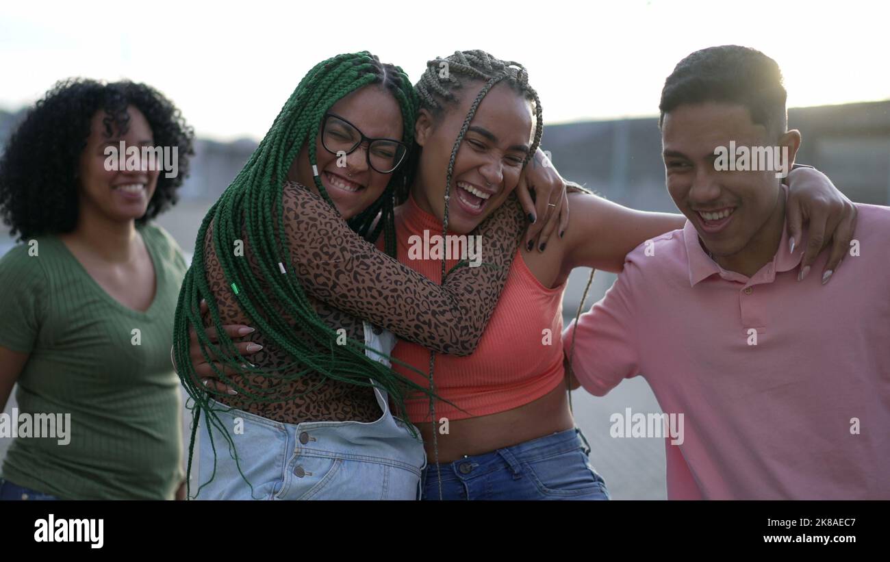 Happy Brazilian people hugging together. South American family embrace ...