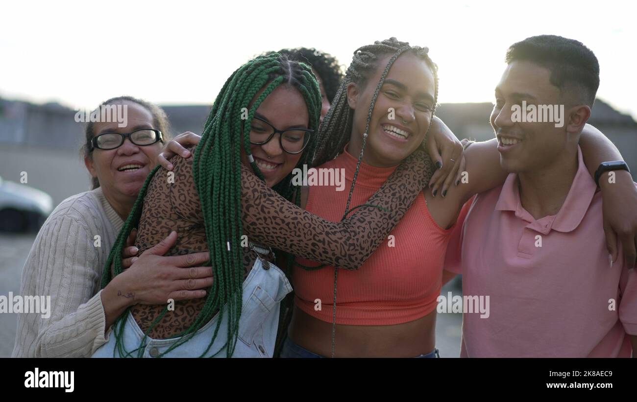 Happy Brazilian people hugging together. South American family embrace ...