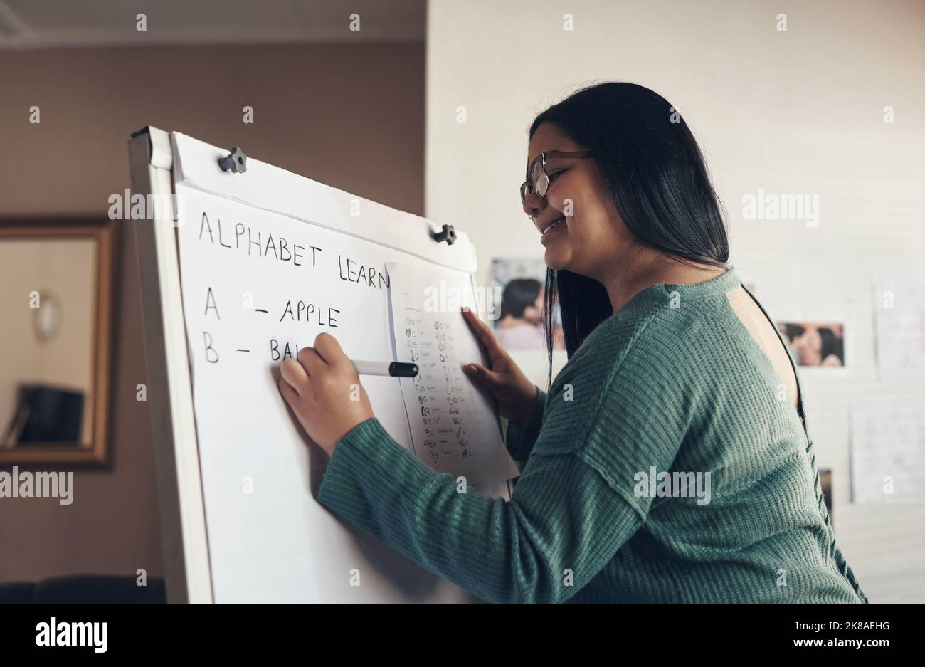 What have you learnt this lockdown. a young woman using a whiteboard to ...