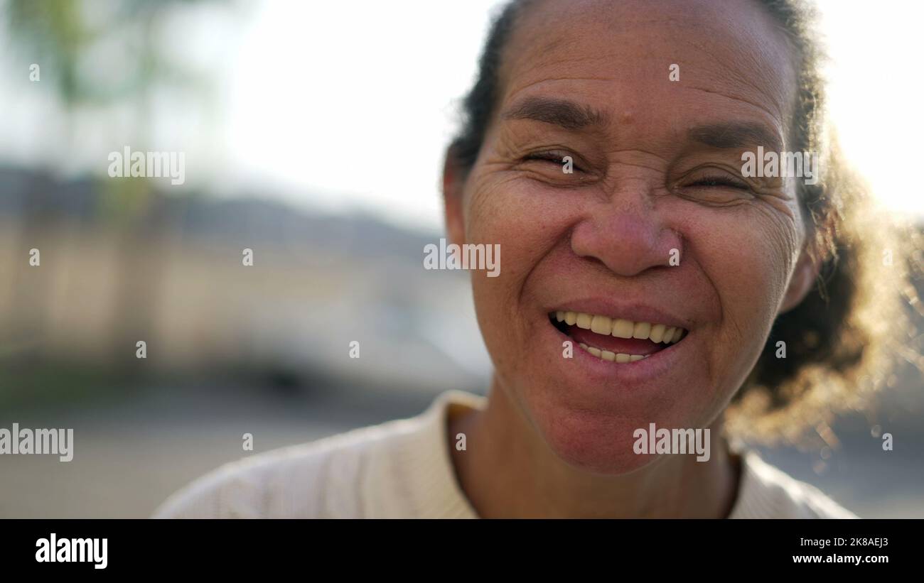 One happy Senior older woman laughing and smiling. Joyful South ...