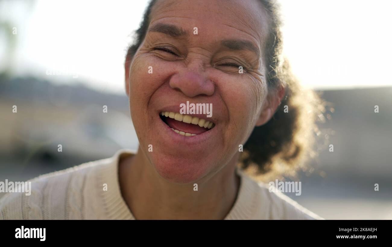 One happy Senior older woman laughing and smiling. Joyful South ...