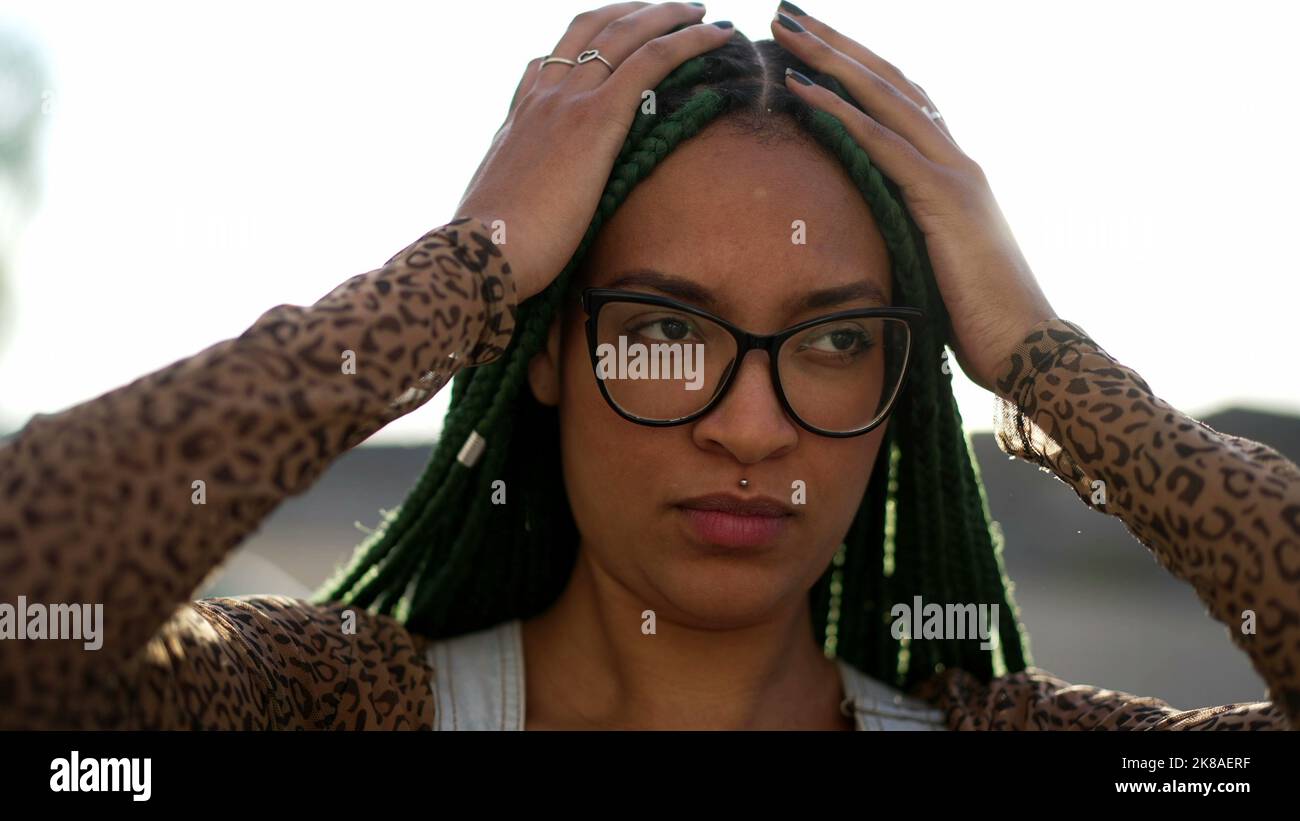One young black latina young woman playing box braided hairstyle ...