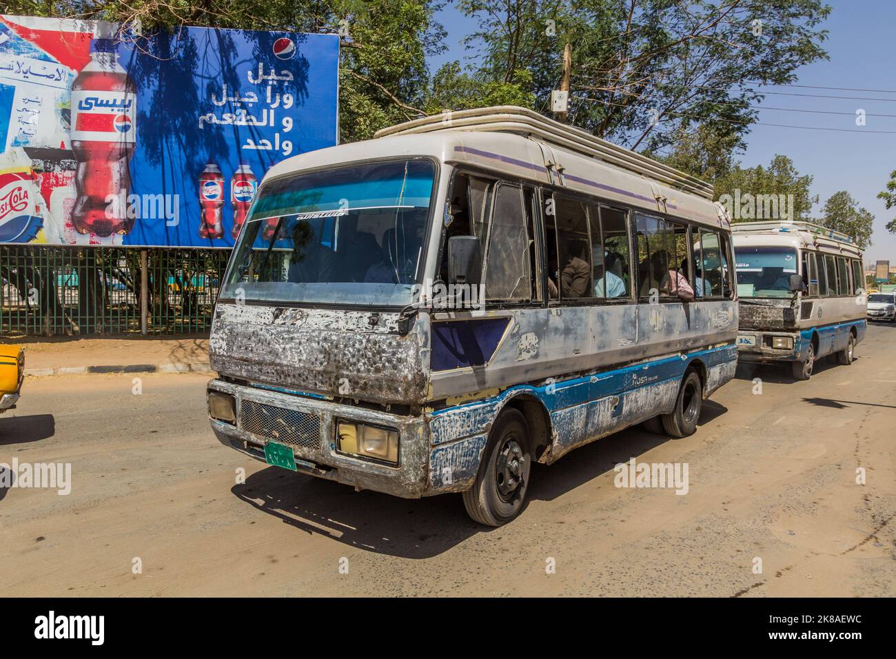 KHARTOUM, SUDAN - MARCH 7, 2019: Beaten buses on a street in Khartoum ...